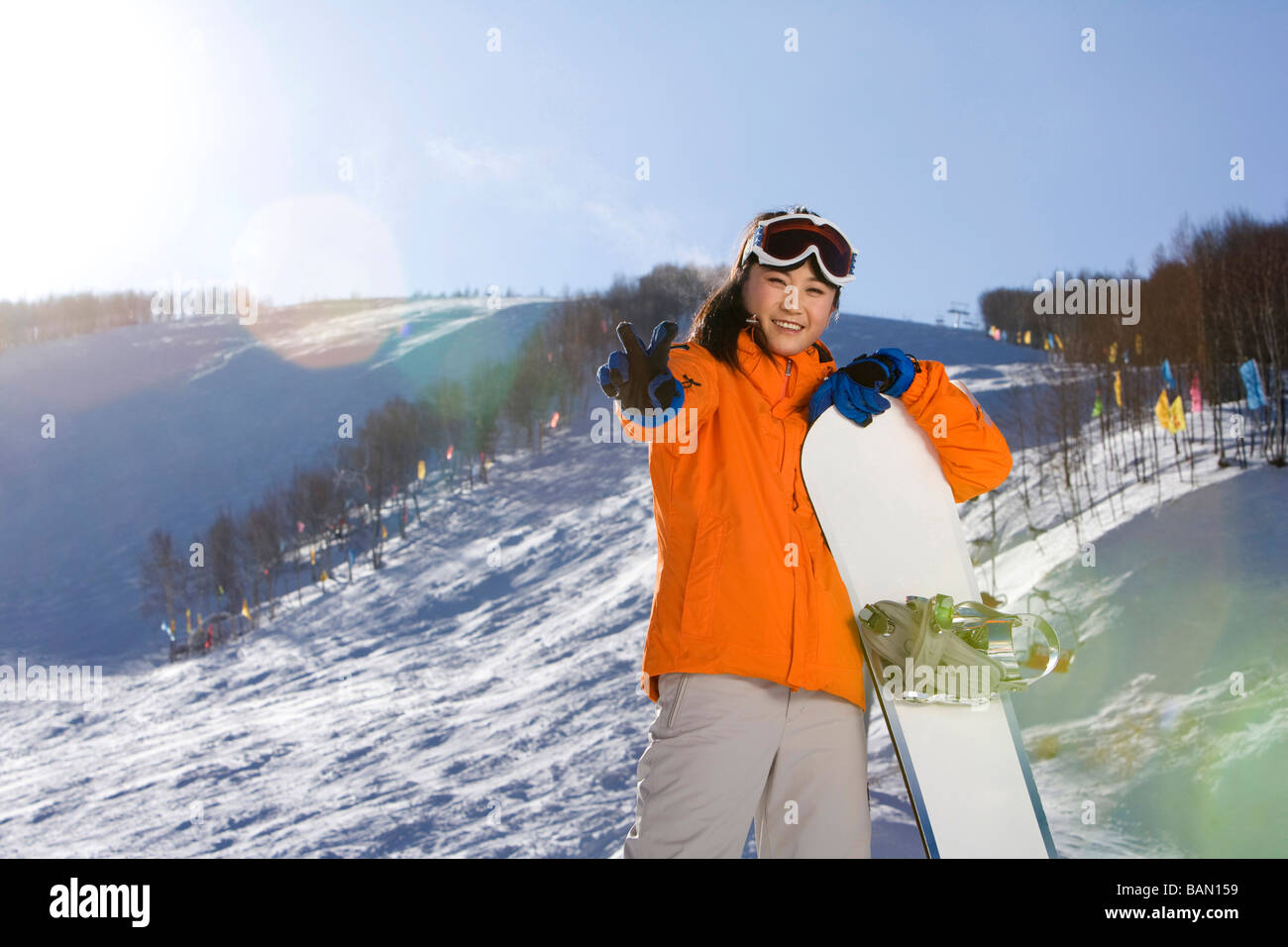 Young woman posing with her snowboard Stock Photo - Alamy