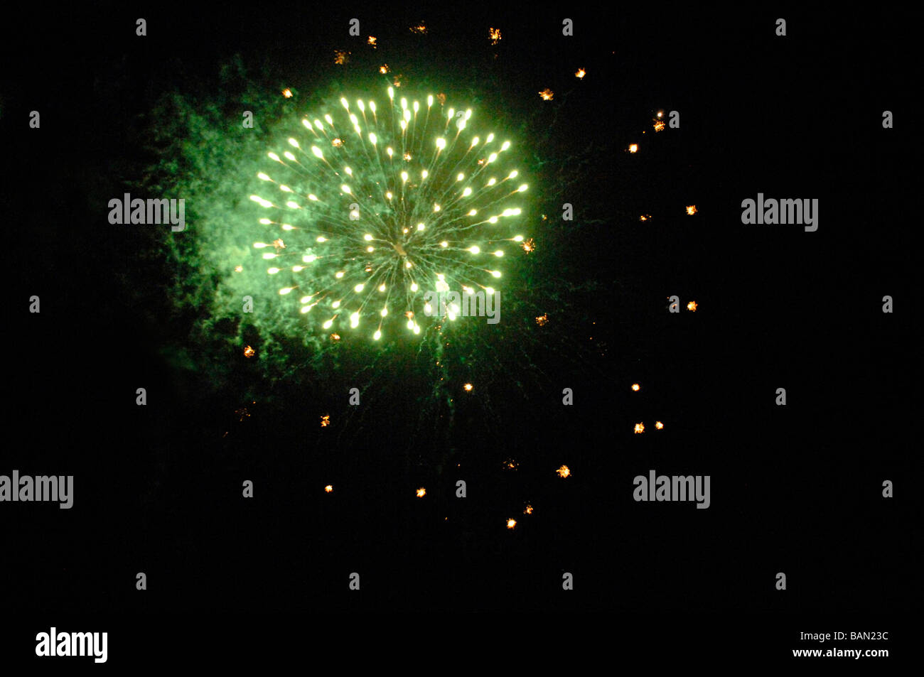Star bursts of fireworks light up the night sky with assorted colors ...
