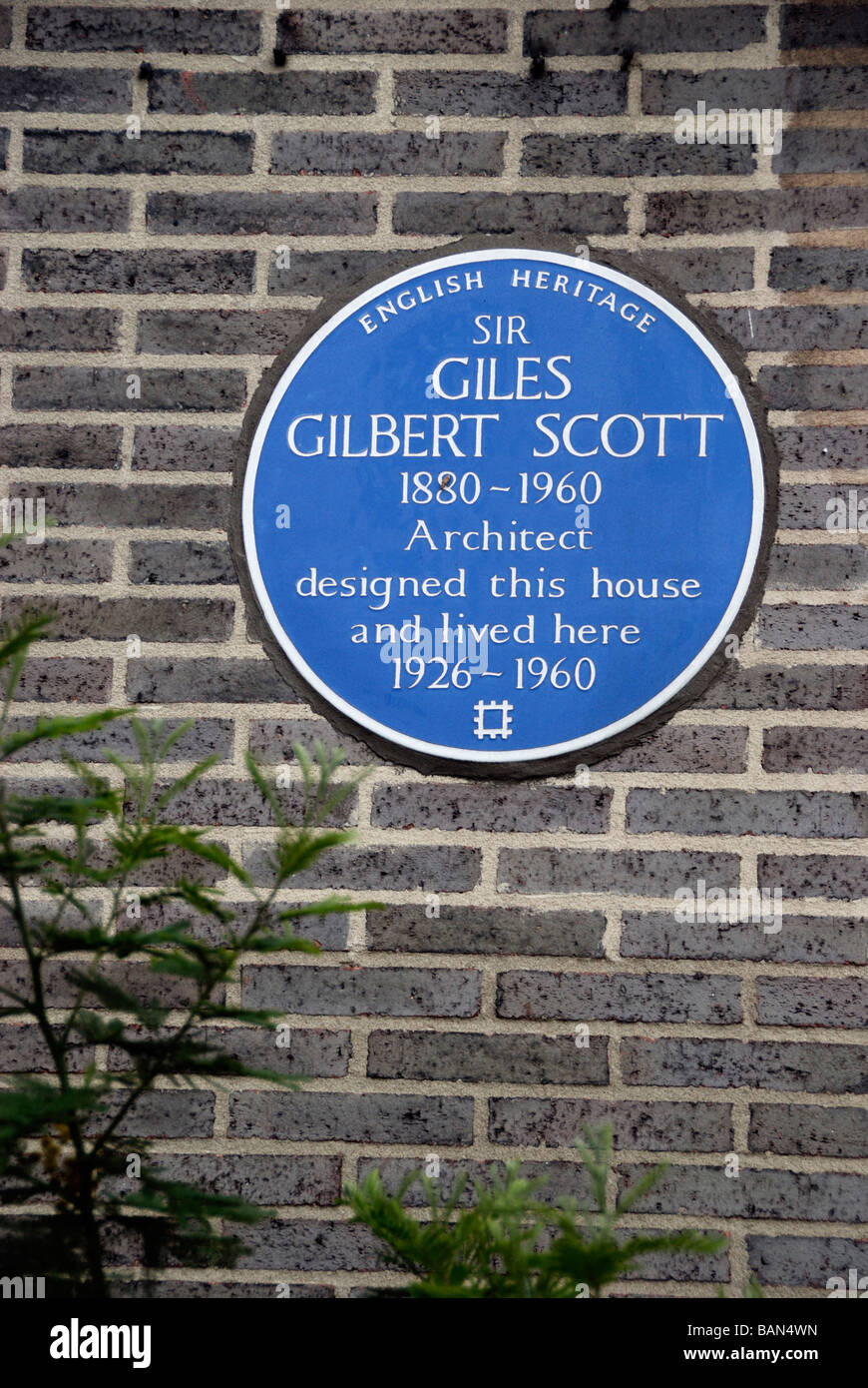 Blue wall plaque marking the former house of the architect Sir Giles ...