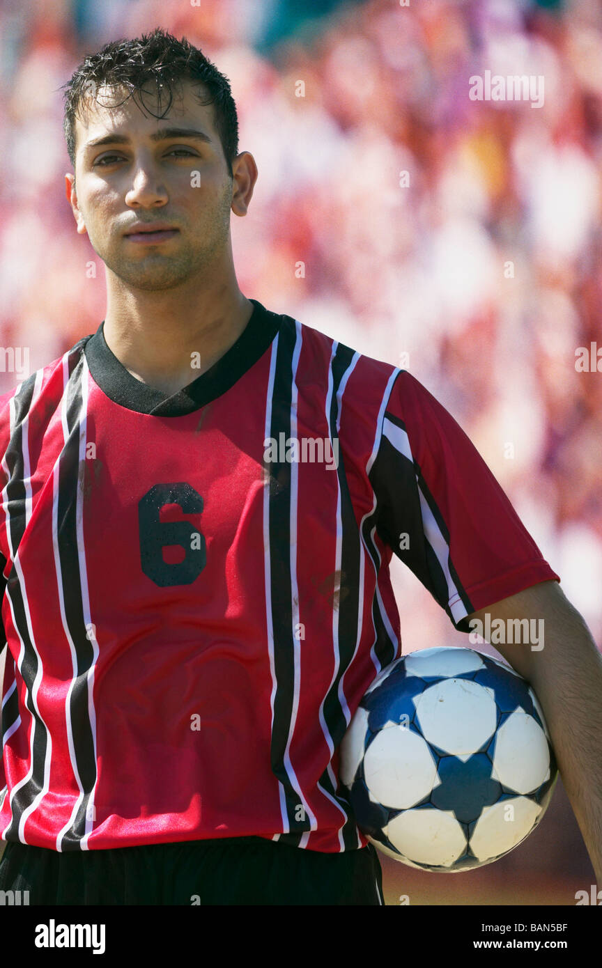 Soccer player posing for the camera Stock Photo - Alamy