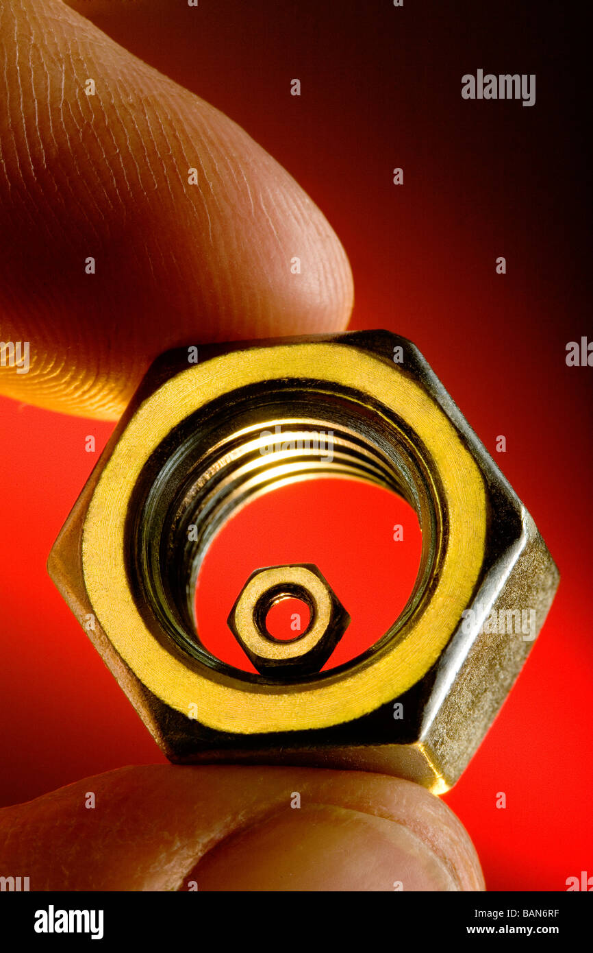 fingers holding nuts Stock Photo - Alamy