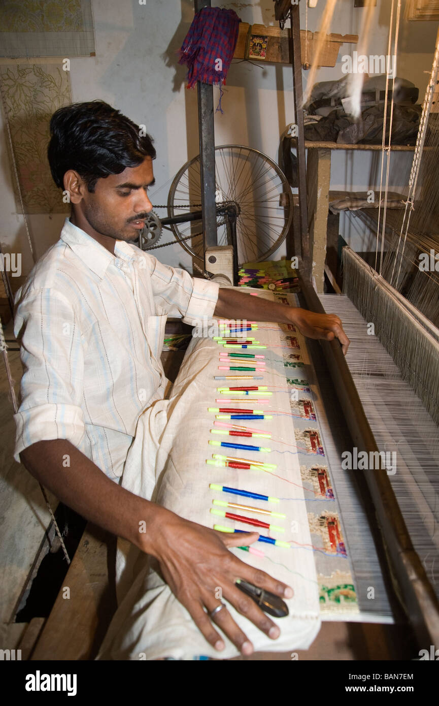 Indian man working on a Sari Stock Photo - Alamy
