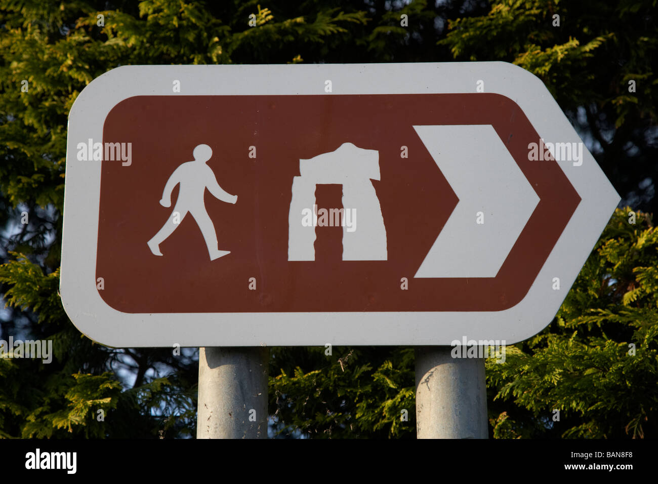 brown information sign indicating footpath to a national historic ...