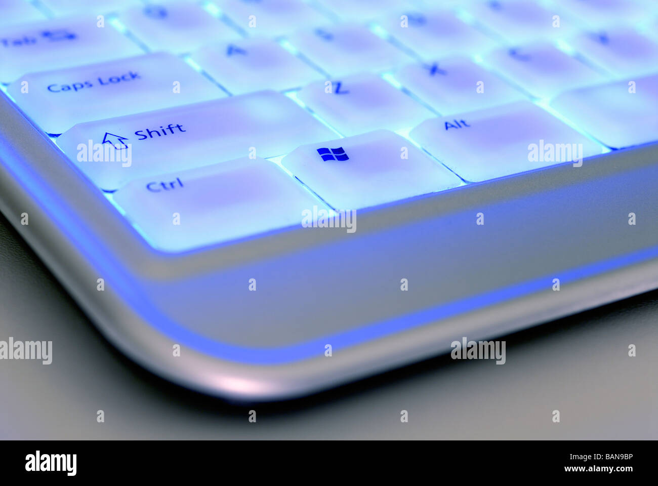 Blue lit up pc keyboard Stock Photo - Alamy