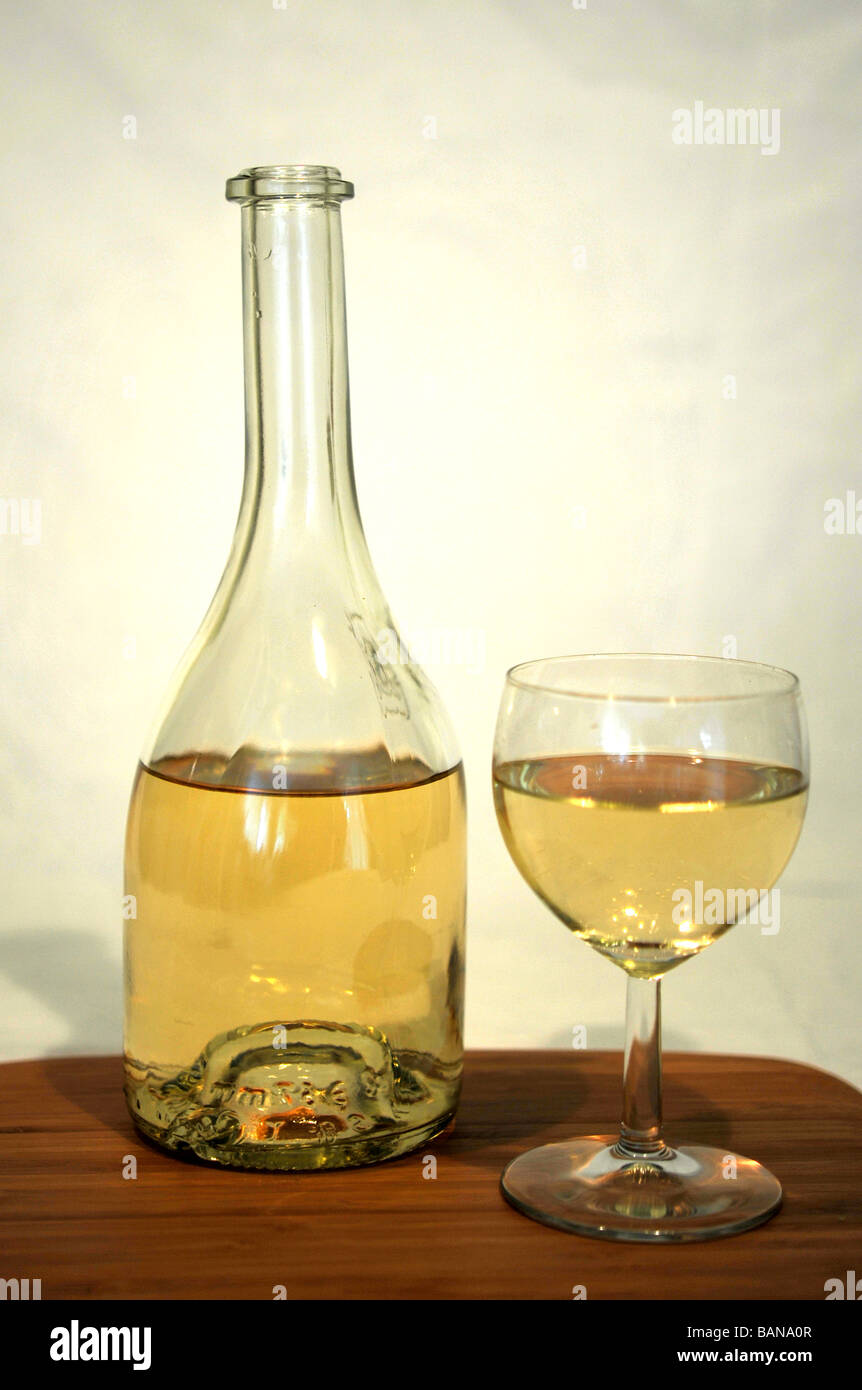 White wine and bottle with a full wine glass Stock Photo - Alamy