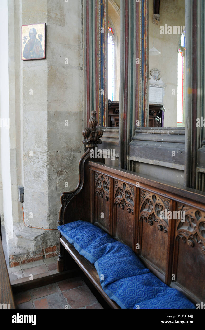Detail ornate carved wooden pew in the 14th century church of St Mary ...