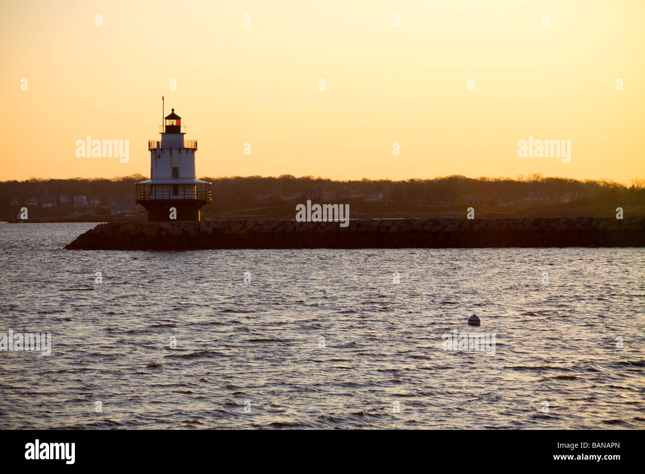 Spring point light sillouetted by the morning sun Stock Photo - Alamy