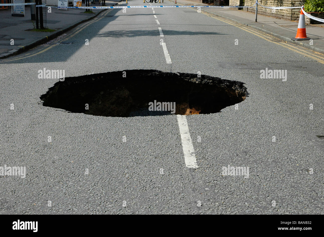 hole in road appeared in didsbury, manchester Stock Photo - Alamy