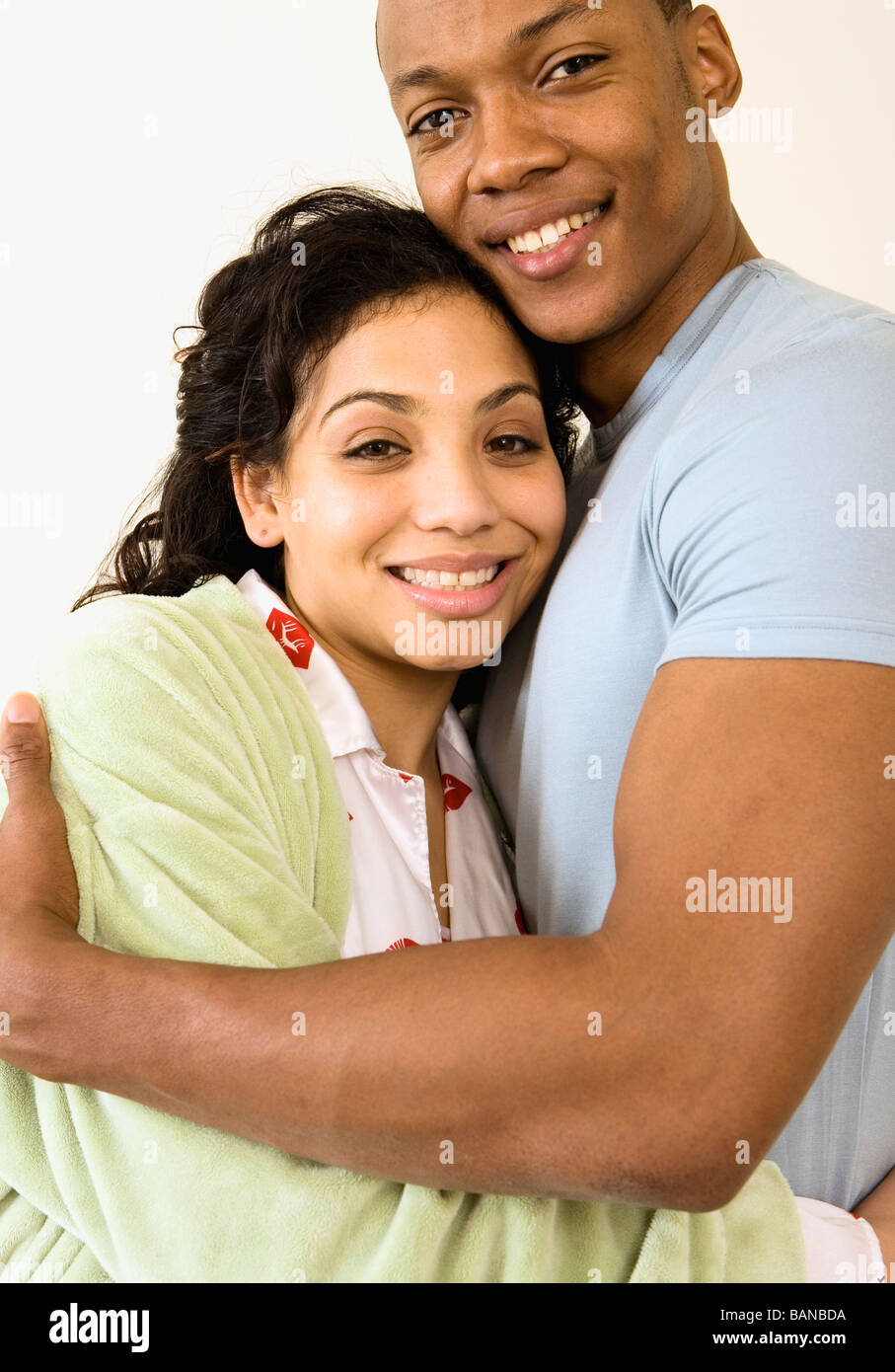 African couple hugging and smiling Stock Photo - Alamy