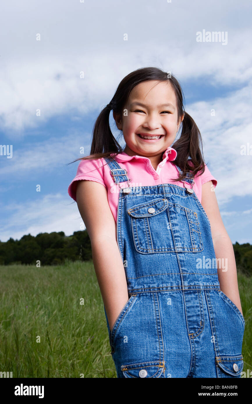 Young Asian girl smiling outdoors Stock Photo - Alamy