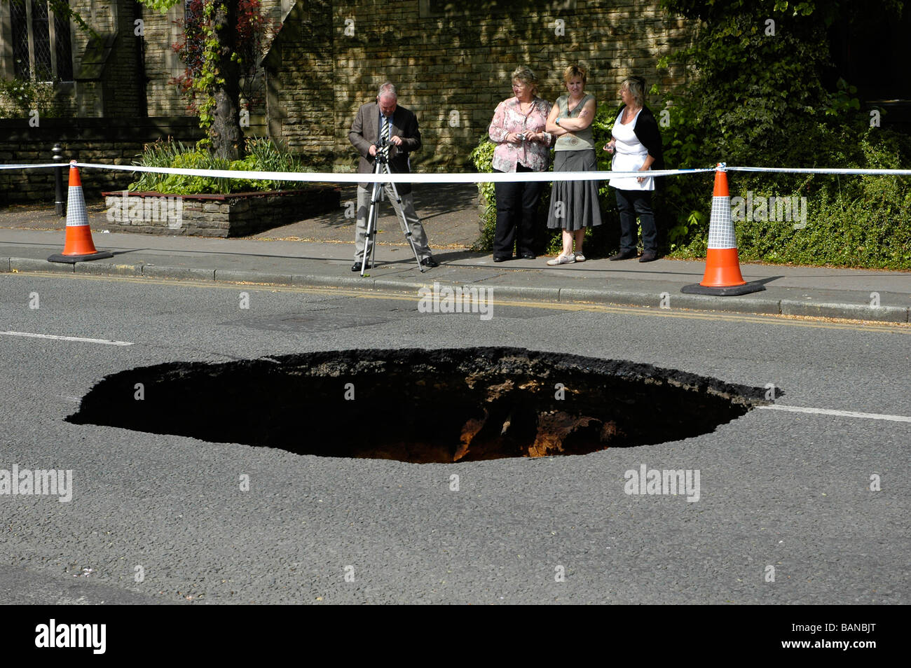 hole in road appeared in didsbury, manchester Stock Photo - Alamy