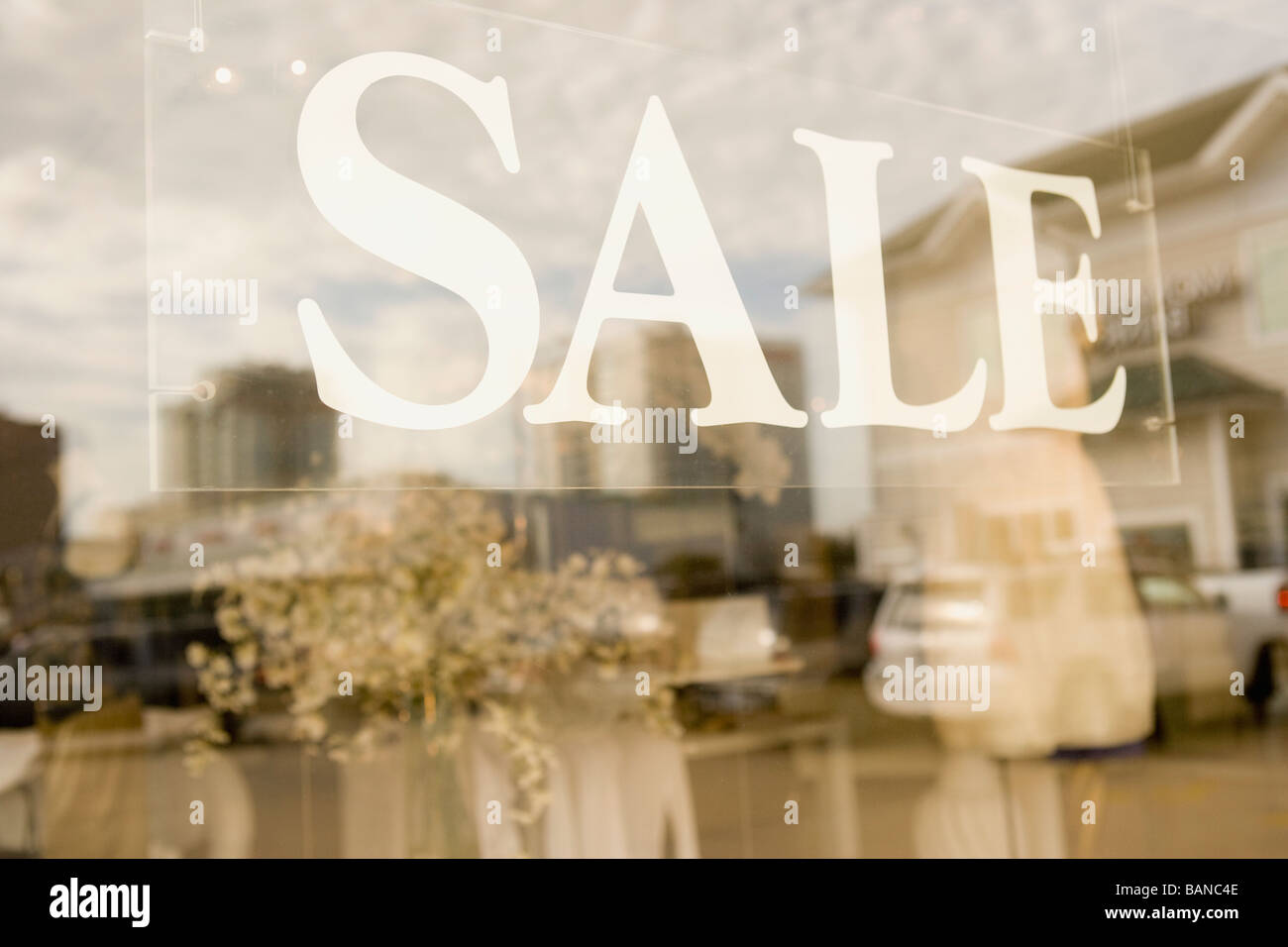 Sale sign in shop window Stock Photo - Alamy