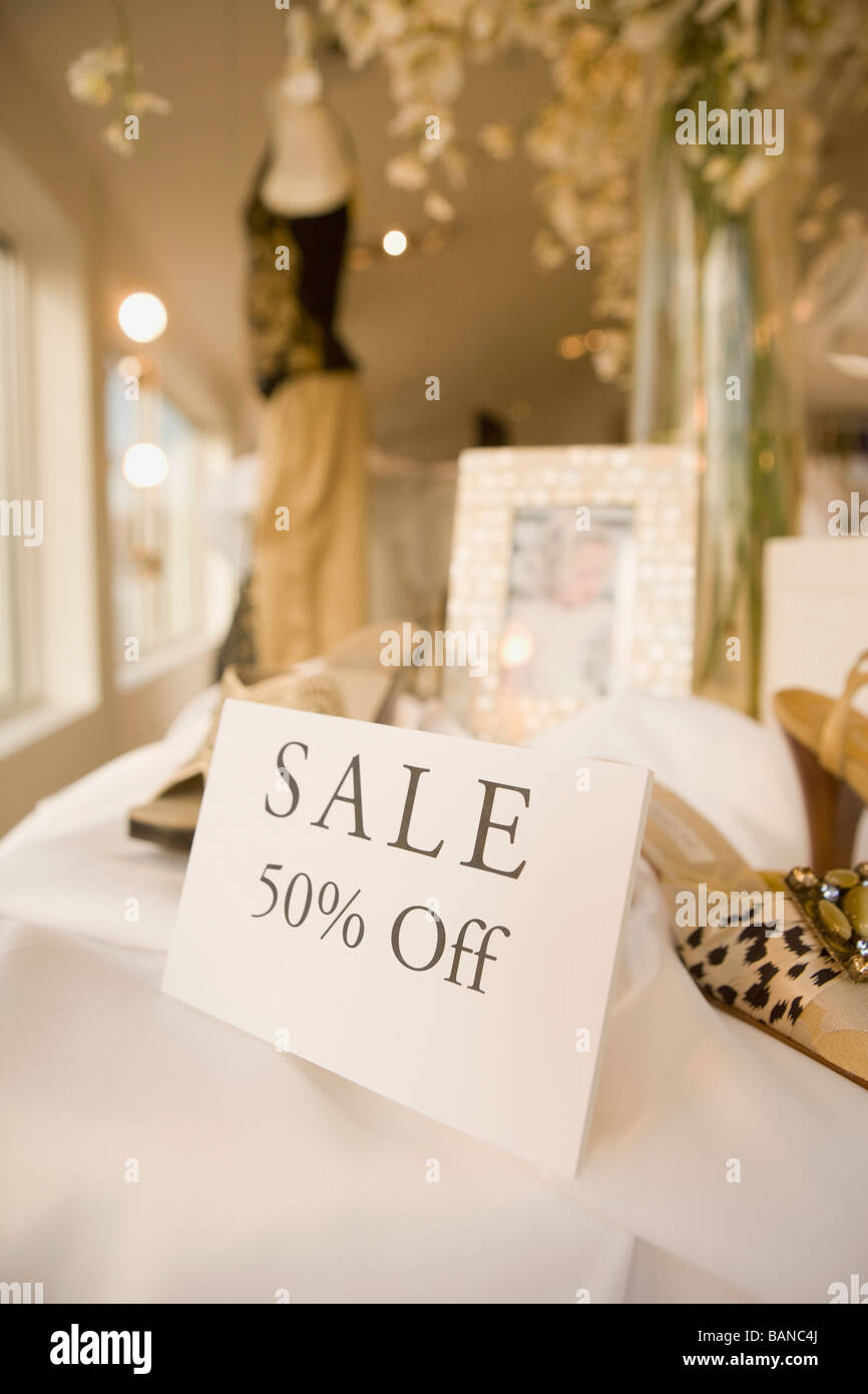Sale sign in shop window Stock Photo - Alamy