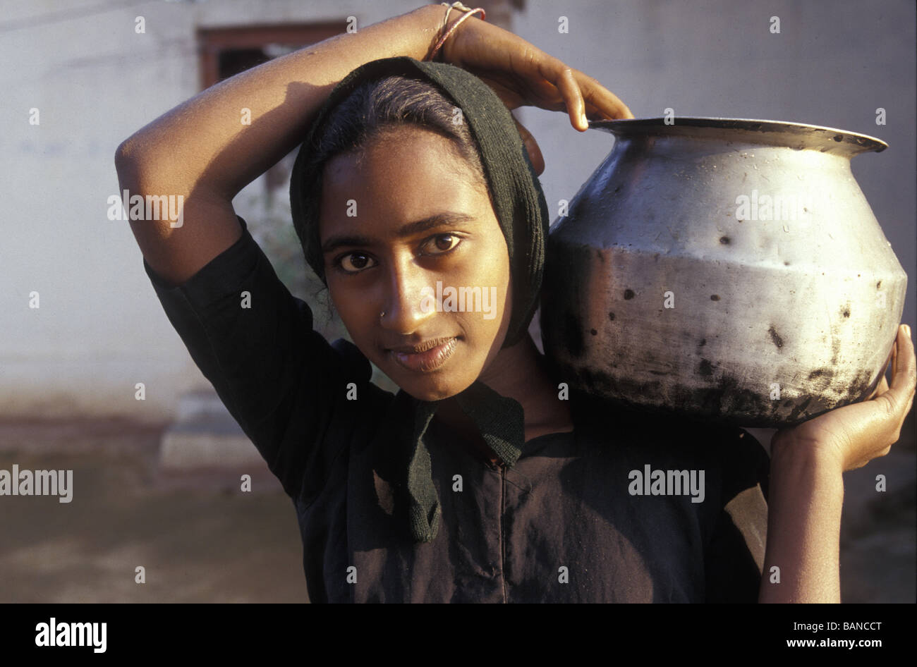 Woman carrying pot water on hi-res stock photography and images - Alamy