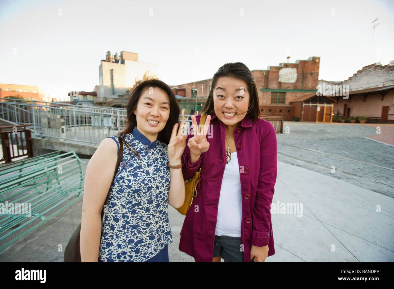 Asian Tourists Peace Sign