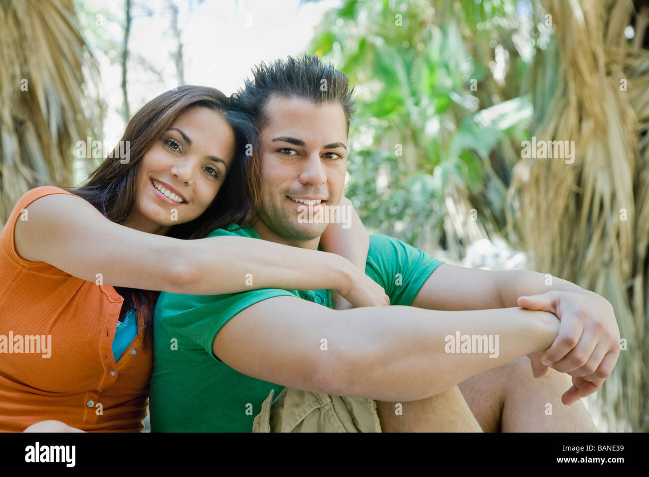 Hispanic couple hugging in tropical area Stock Photo - Alamy