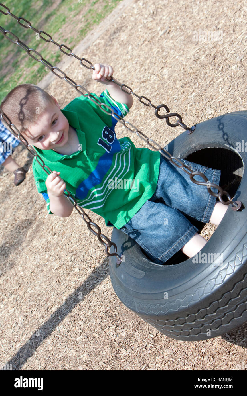 Boy on a tyre hi-res stock photography and images - Alamy