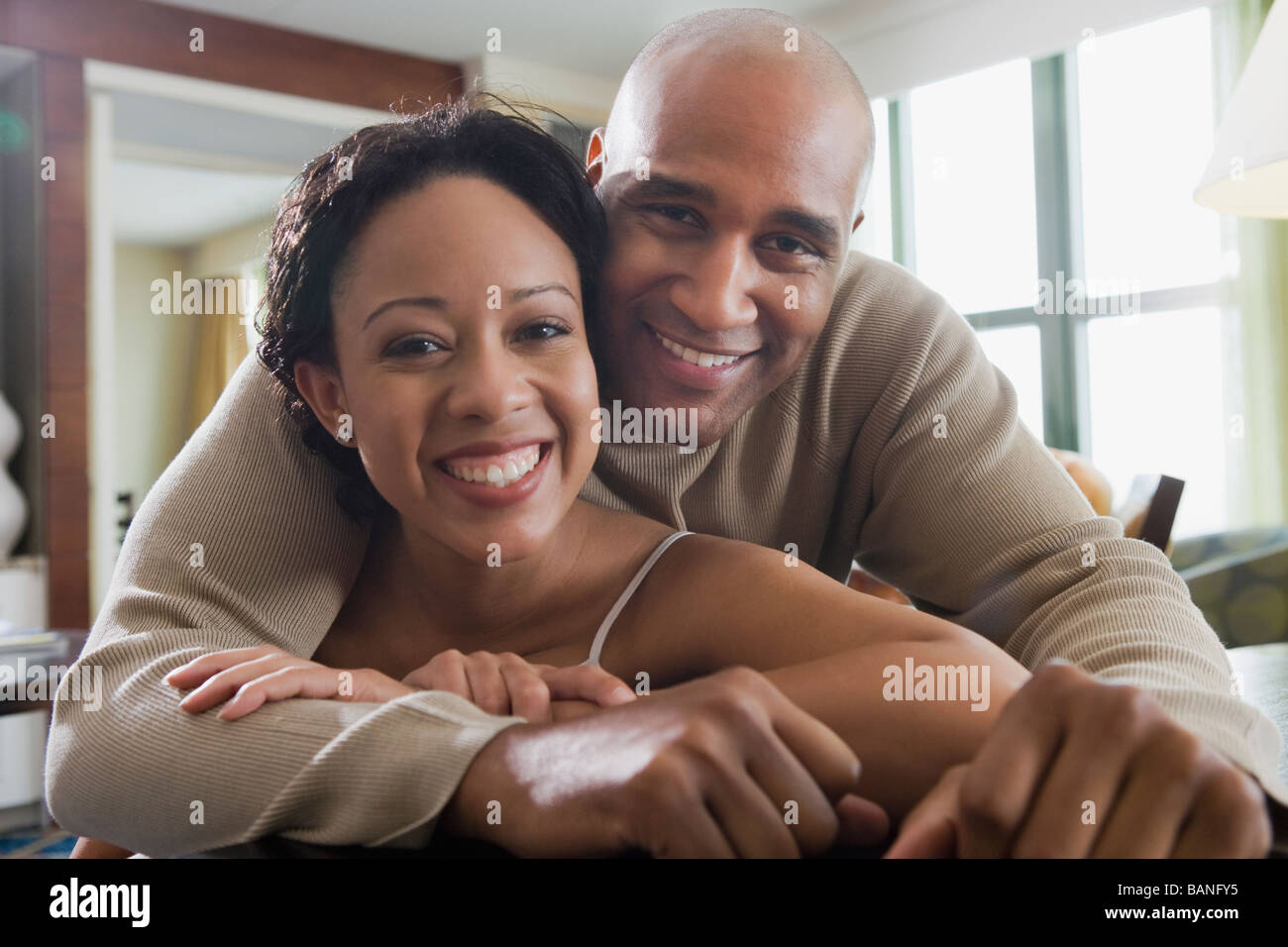 African couple hugging Stock Photo - Alamy
