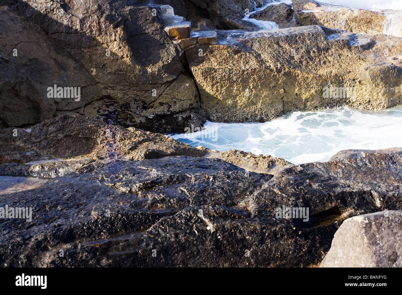 Waves surf splashing against rocks hi-res stock photography and images ...