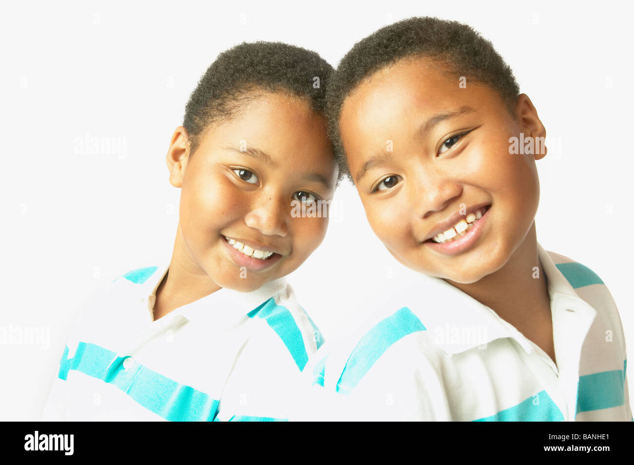 Studio shot of young African twin brothers smiling Stock Photo - Alamy