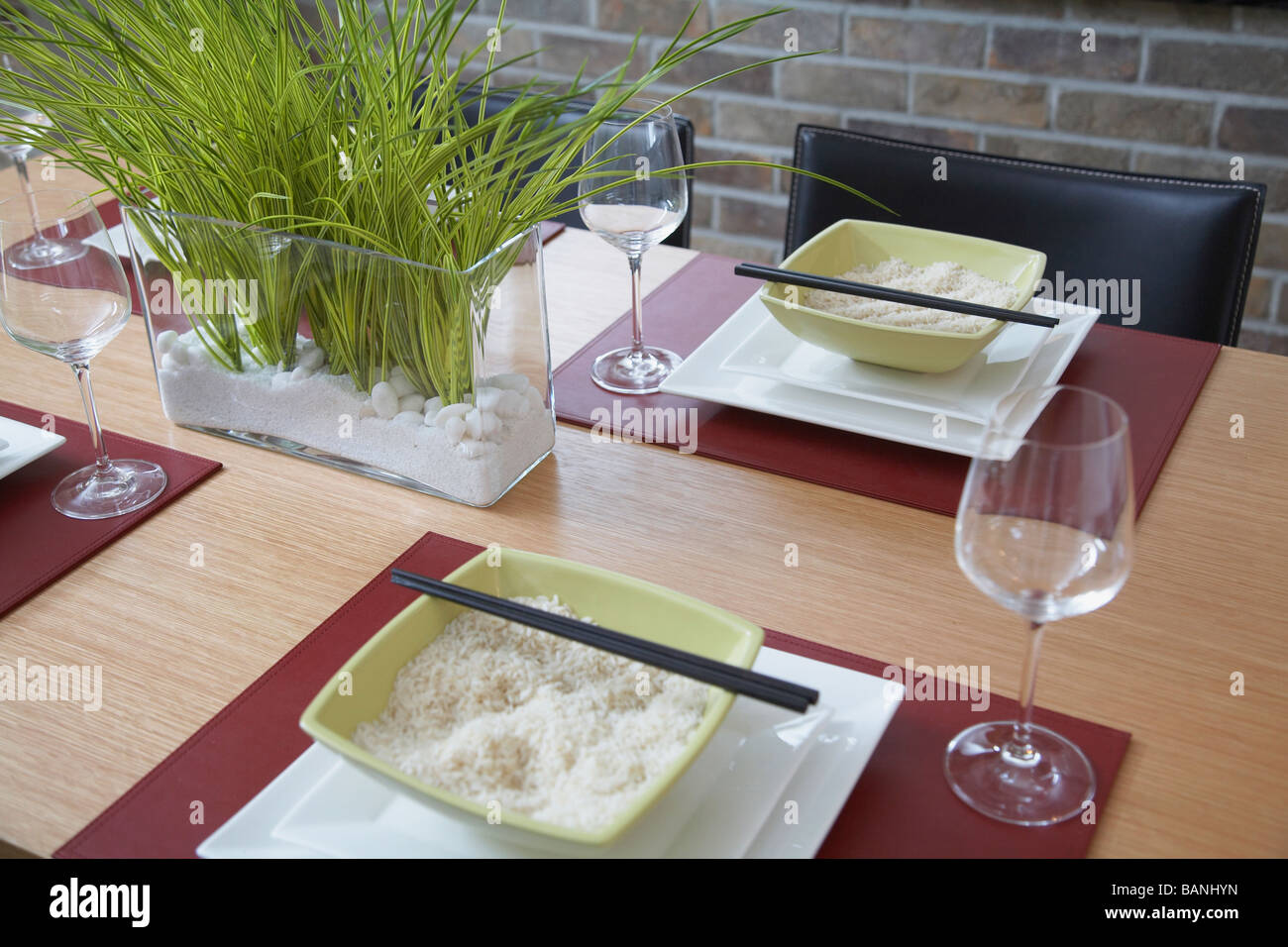 Table set with rice bowls and chopsticks Stock Photo - Alamy
