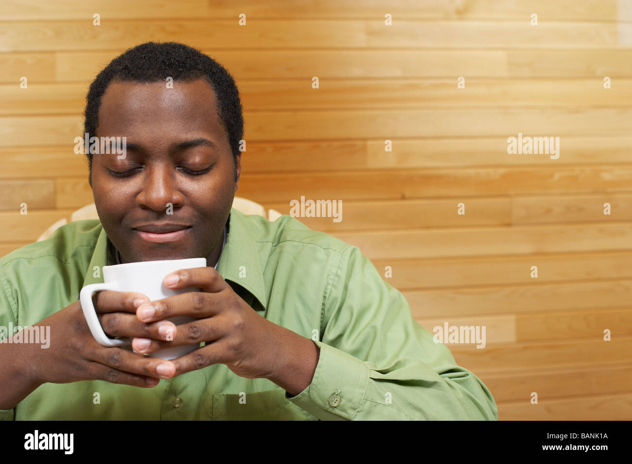 African man smelling cup of coffee Stock Photo - Alamy
