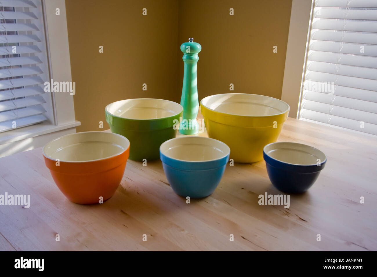 Empty bowls set on a table Stock Photo - Alamy
