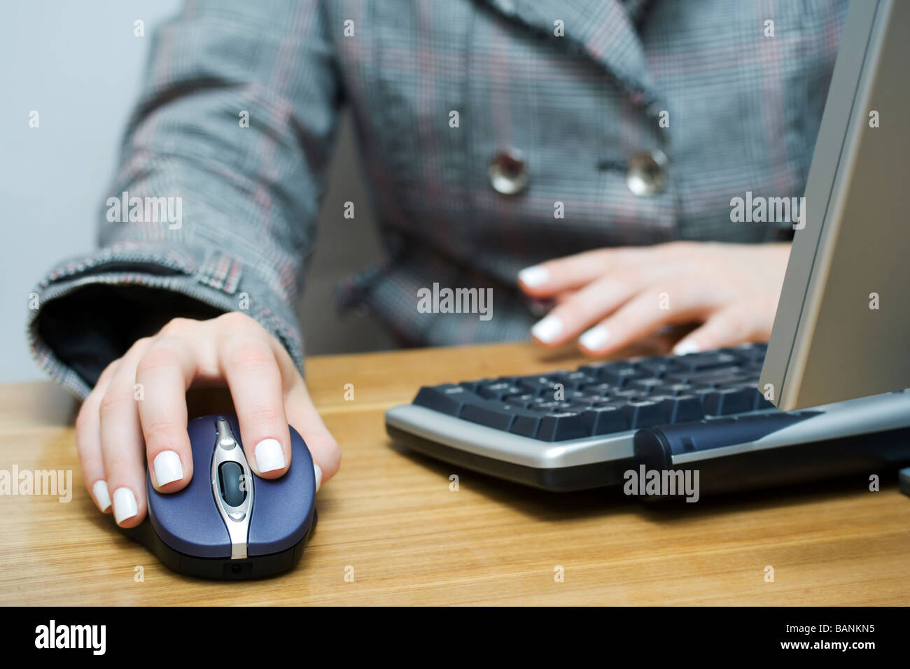 Female hands using computer Stock Photo - Alamy