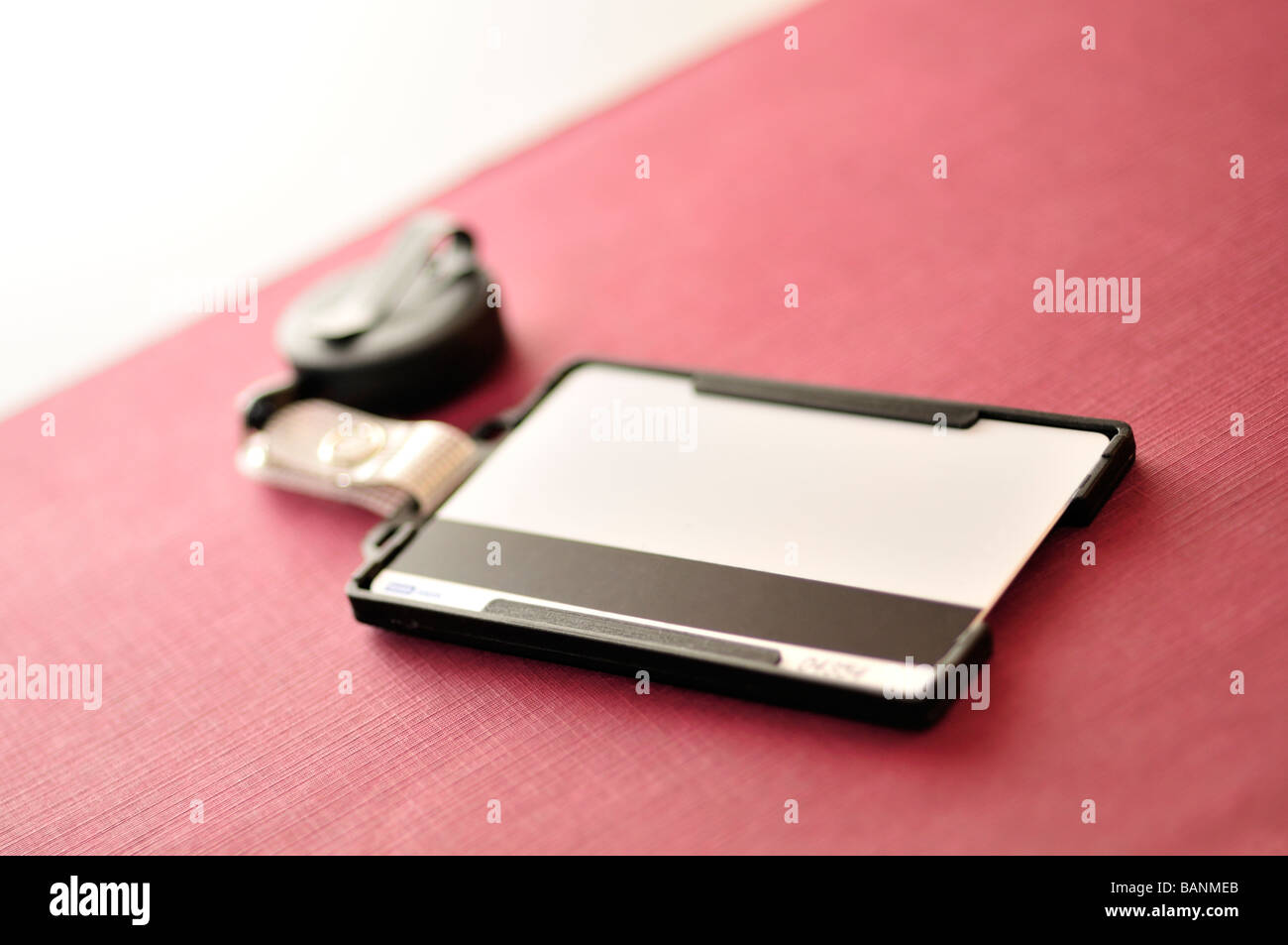 Blank security access pass in holder with belt hook showing magnetic ...