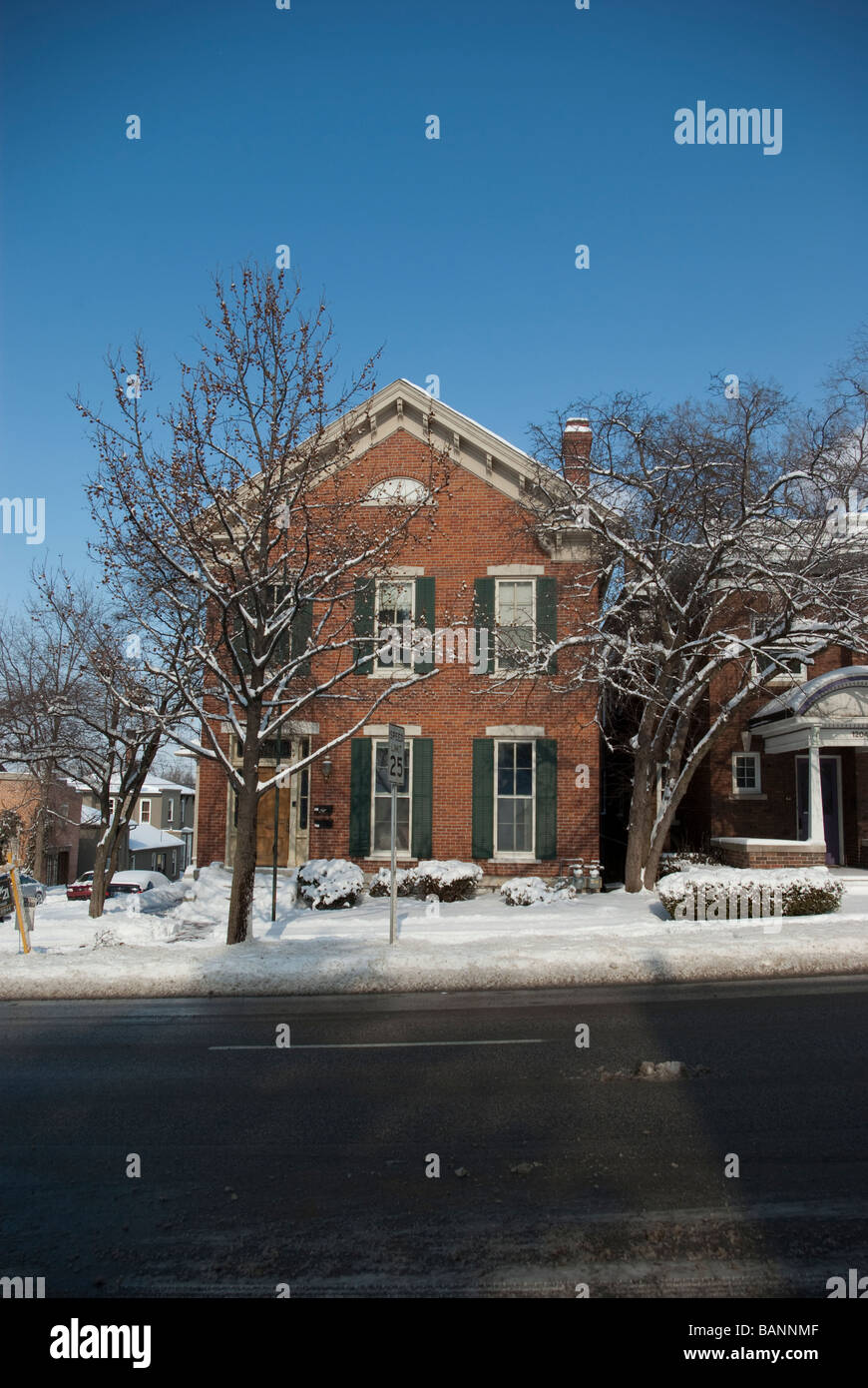 A brick building stands amongst snowy trees Stock Photo - Alamy