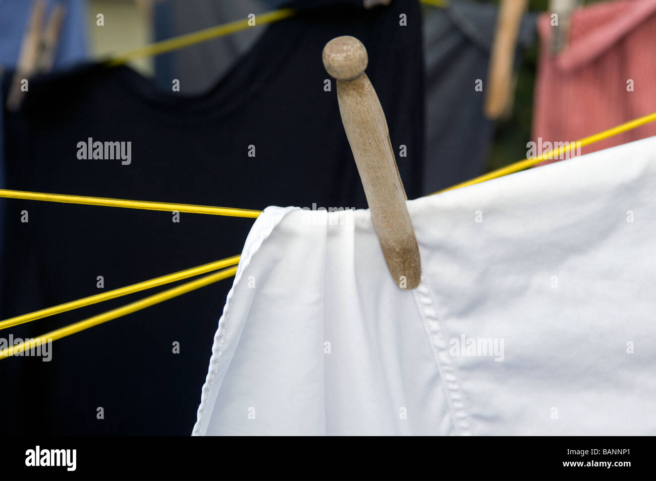 Washing on a clothes line held out by a clothes peg Stock Photo - Alamy