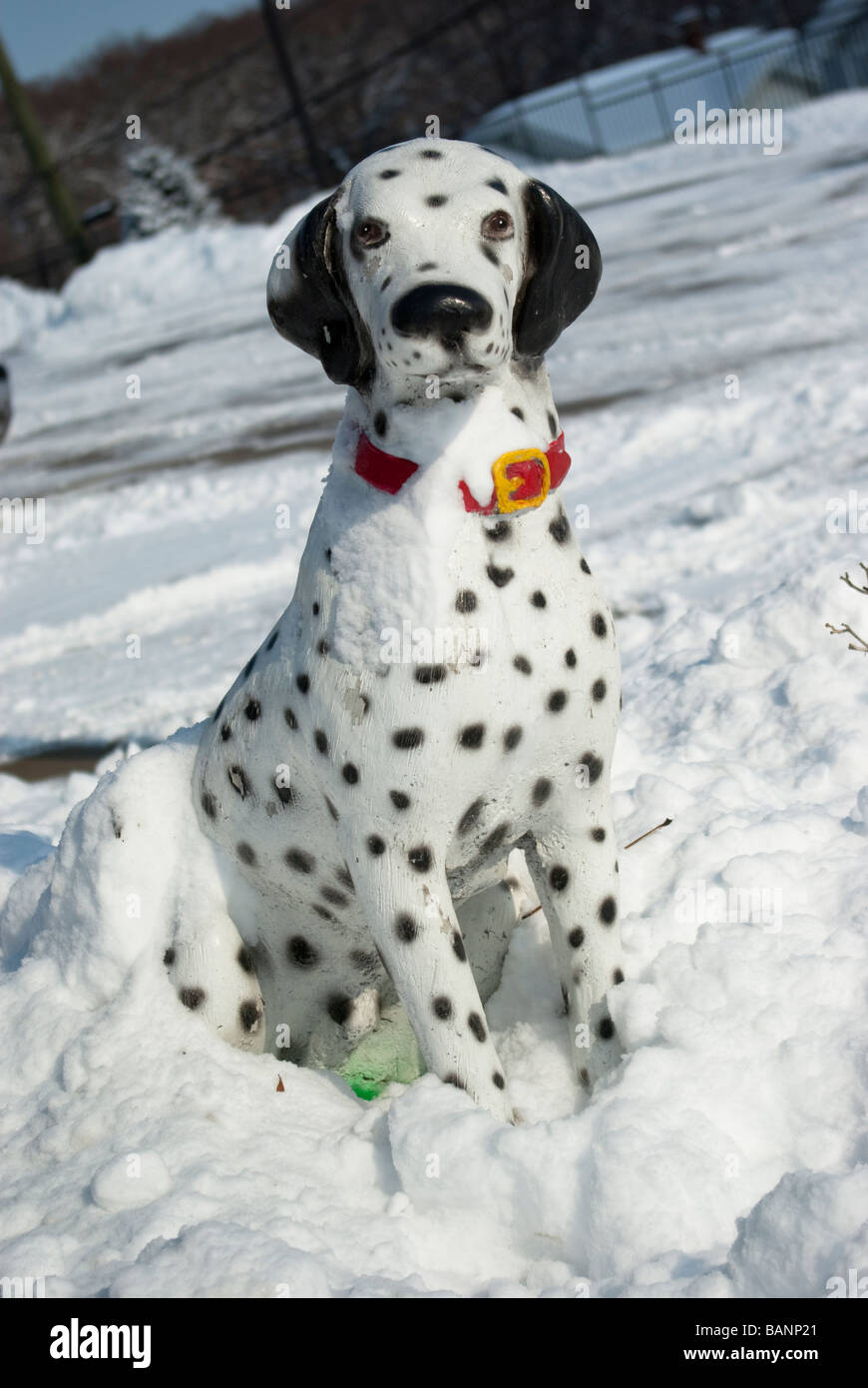 A statue of a dalmation stands guard outside a fire station after a ...