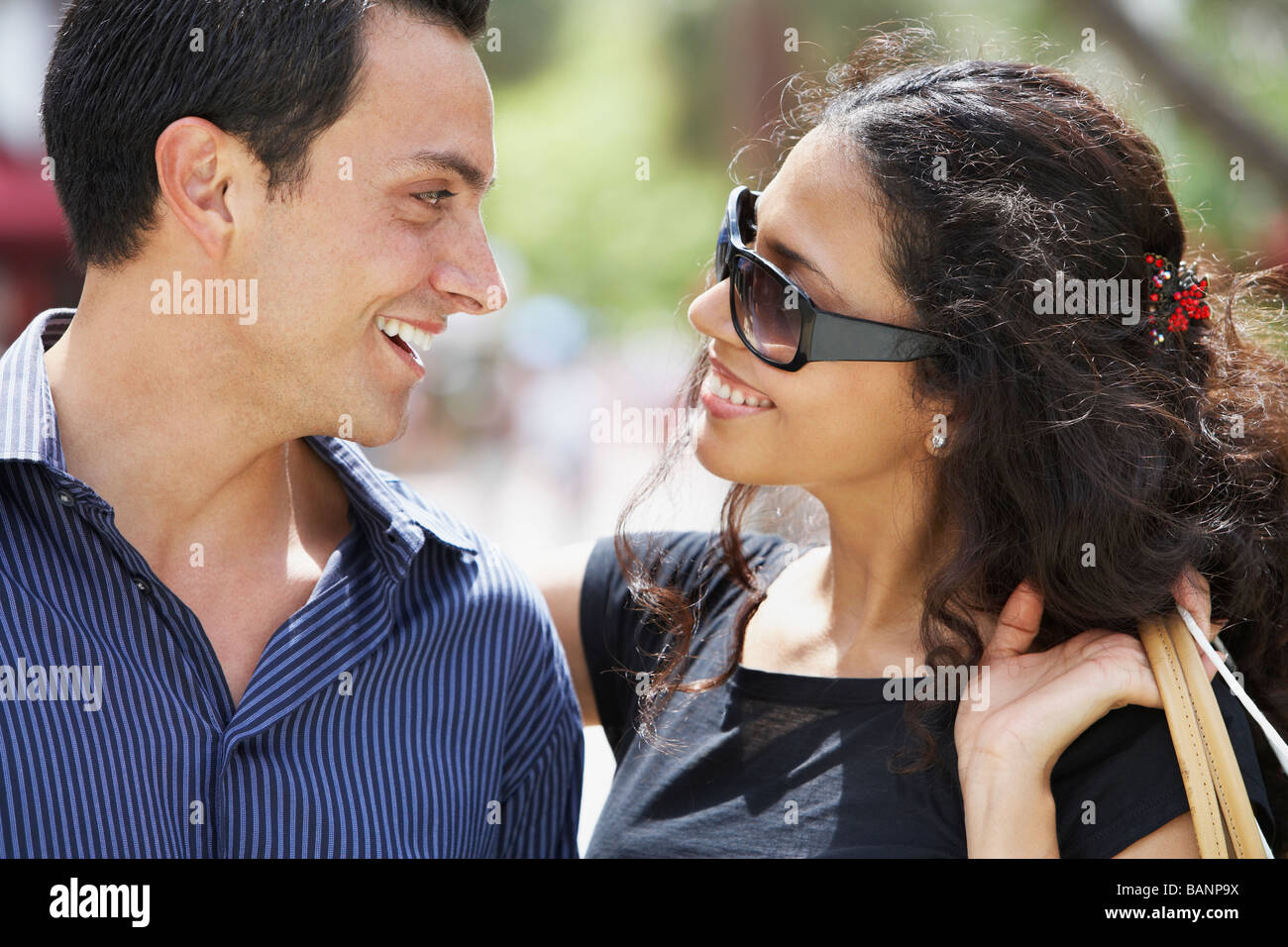 Couple smiling at each other Stock Photo - Alamy