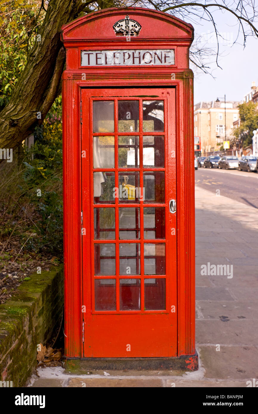 Traditional old red telephone box still in operation in Highgate North ...