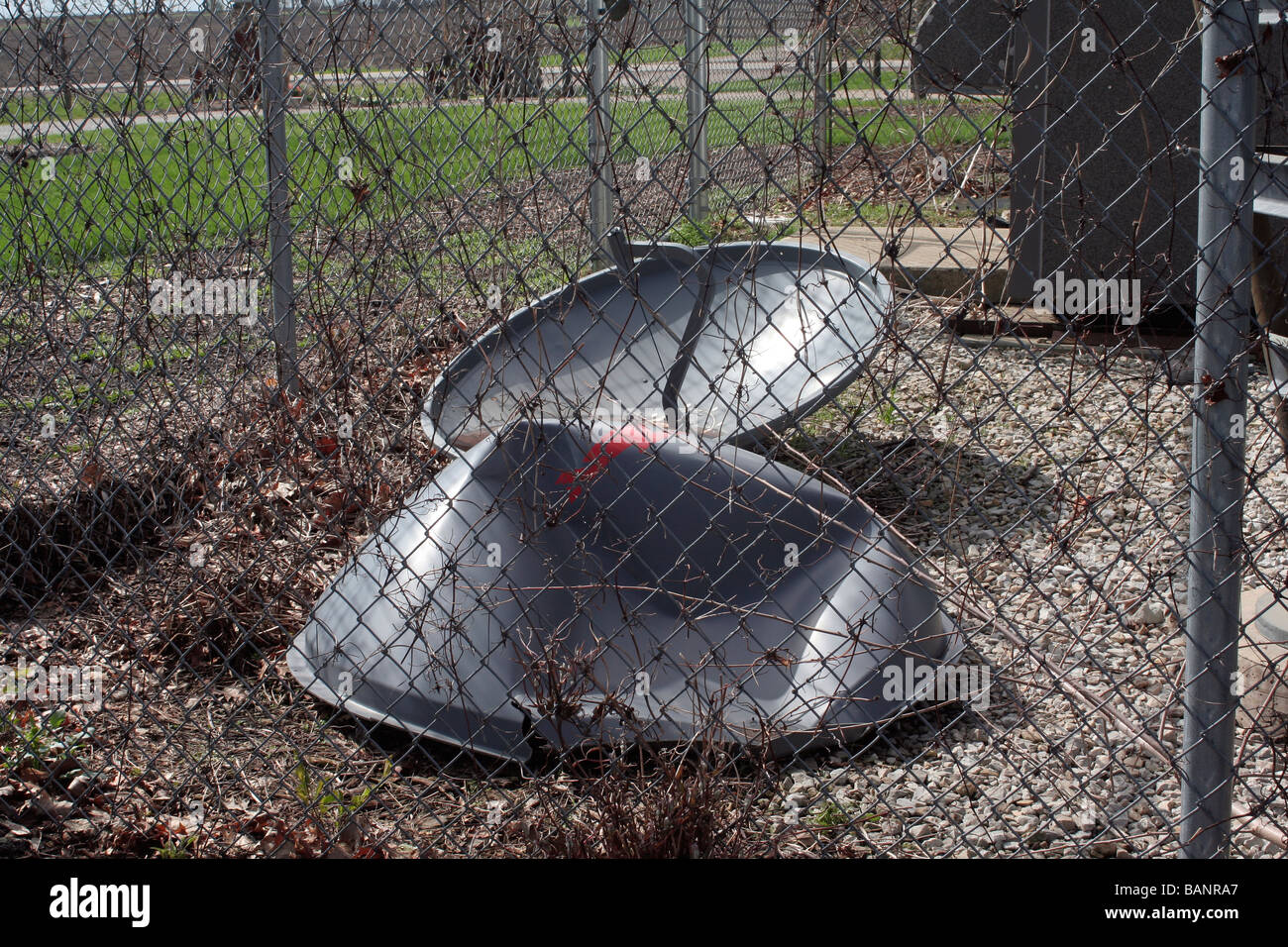 Damaged microwave dishes in secure area Stock Photo - Alamy