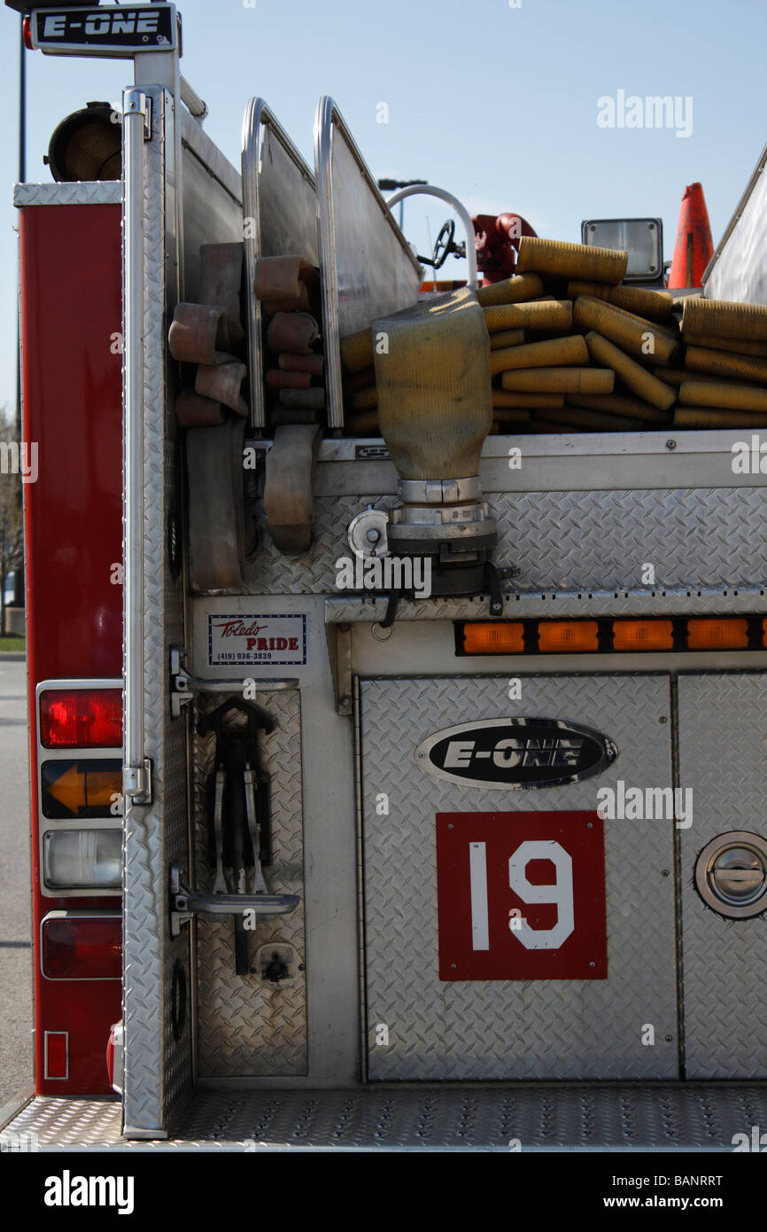 American red fire rescue truck parked in the city street side view ...