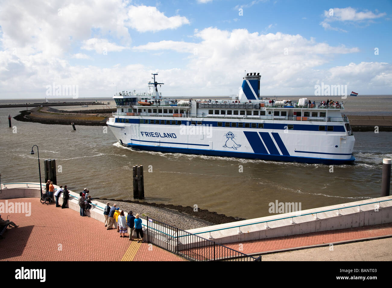 Frisian Islands ferry leaving port watched by tourists Harlingen ...