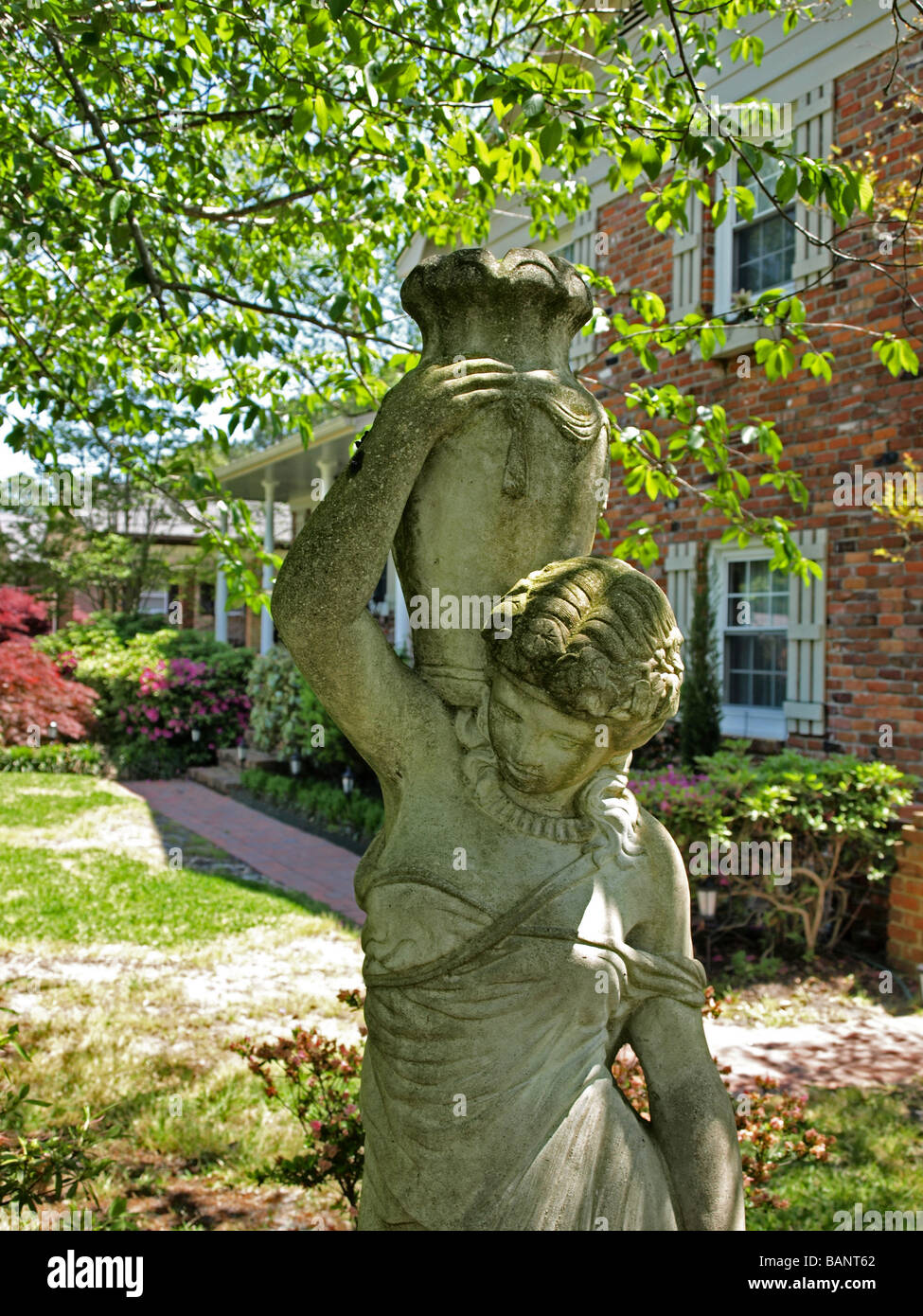 yard statue of women holding vase with Greek or Roman feel stone ...