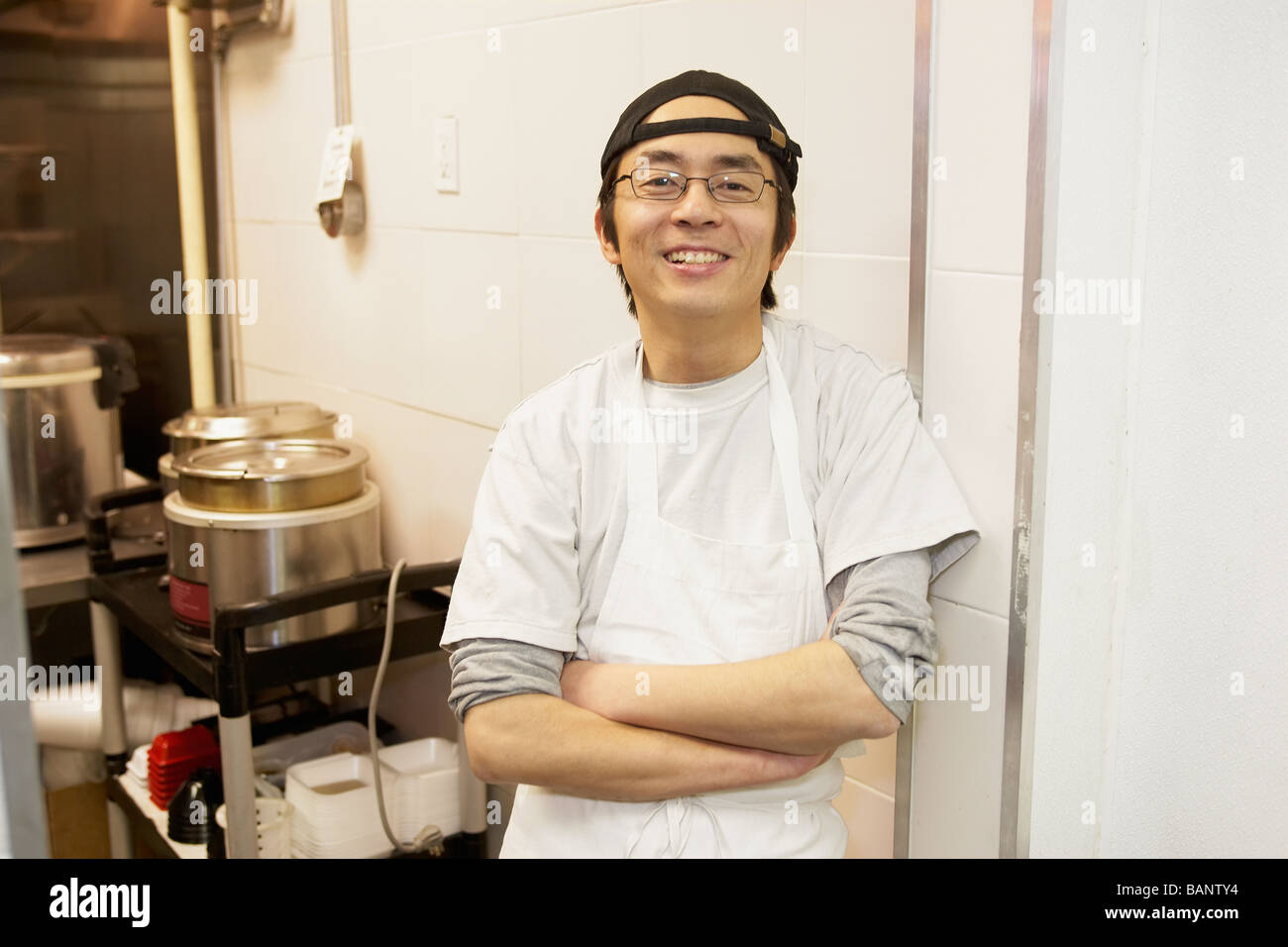 Japanese chef smiling in commercial kitchen Stock Photo - Alamy