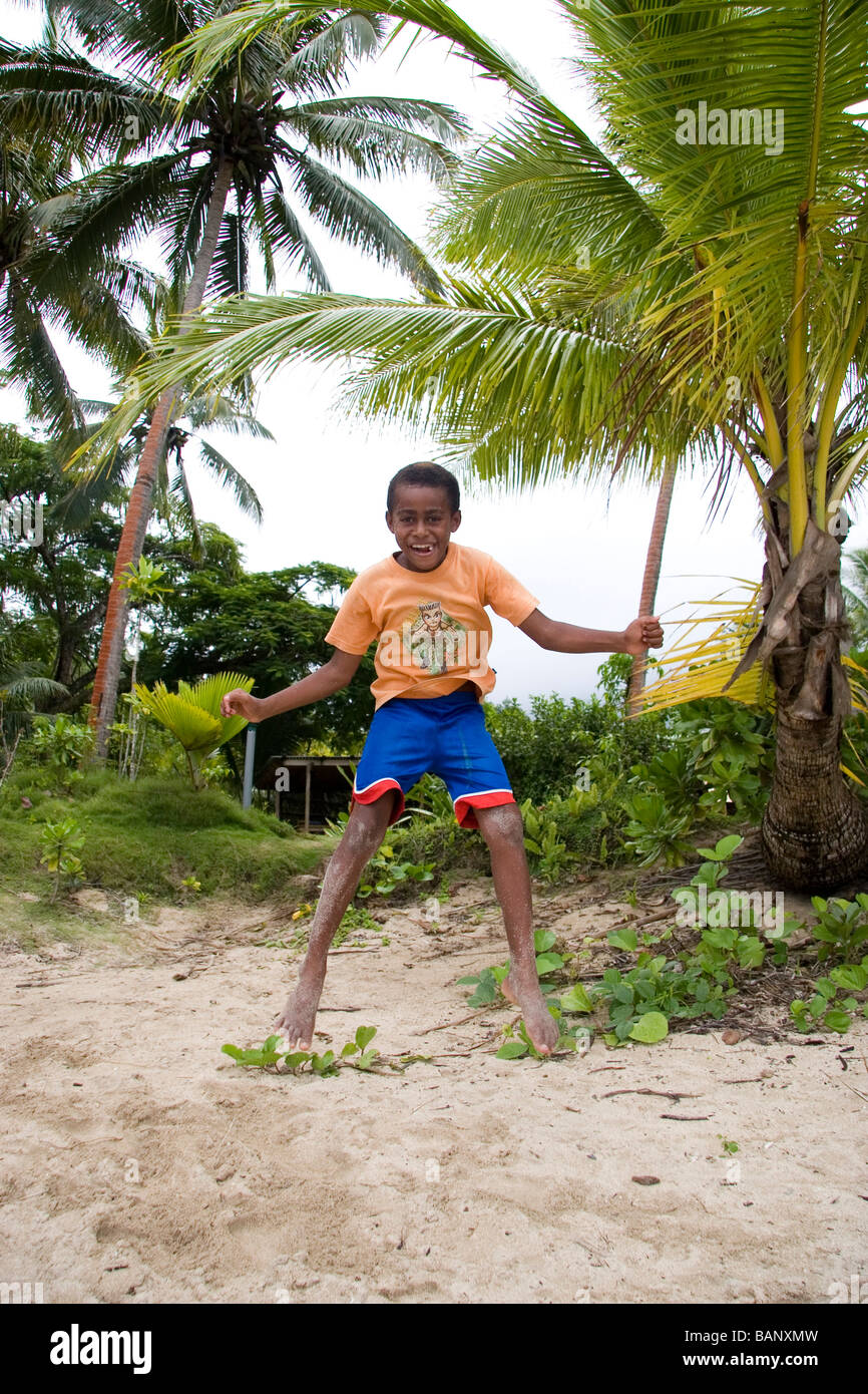 Young Fijian boy jumping Stock Photo - Alamy