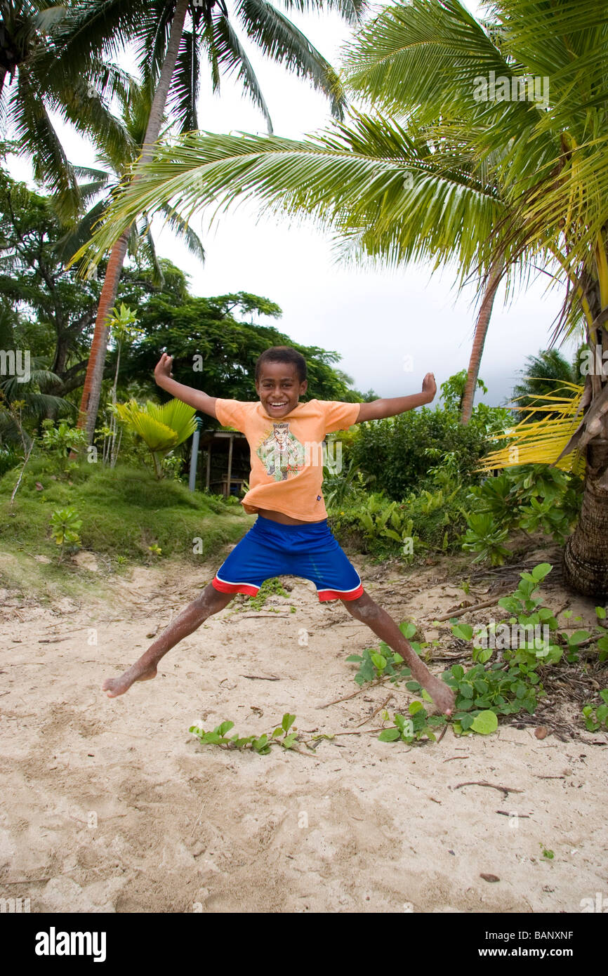 Fijian boy jumping Stock Photo - Alamy