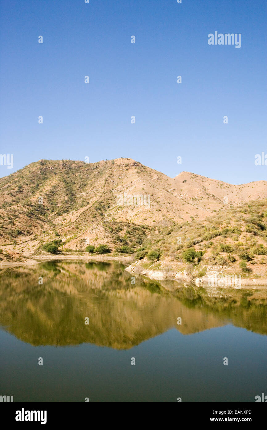 Reflection of mountain in a pond, Udaipur, Rajasthan, India Stock Photo ...