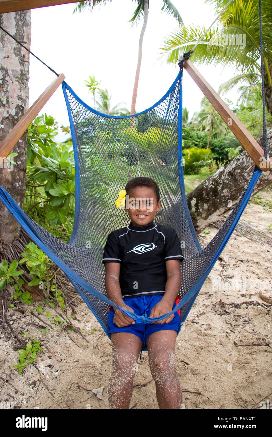 Fijian boy in swing Stock Photo - Alamy