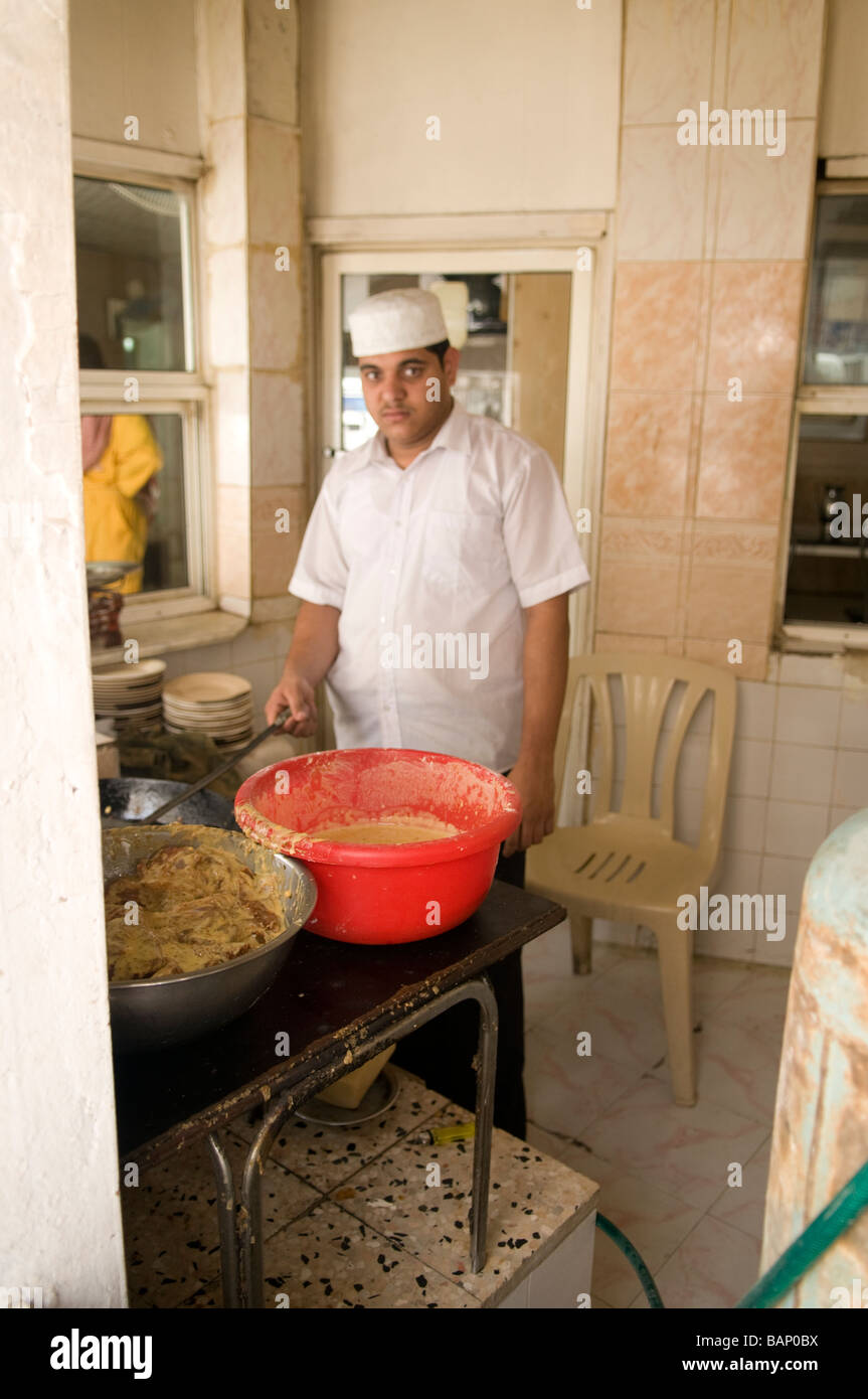 Arabic fast food preparation area with Chef Stock Photo - Alamy