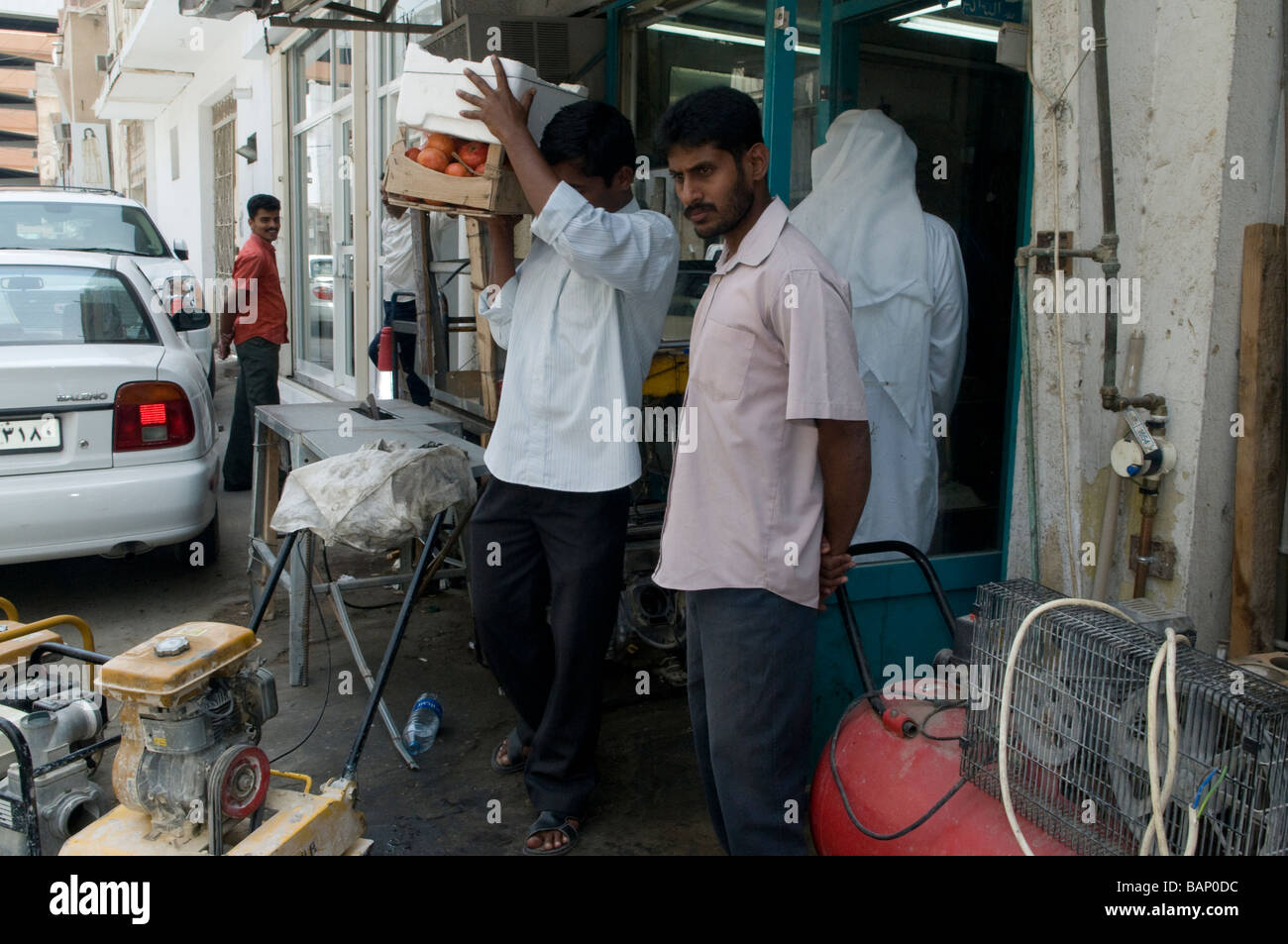 Engineering shop in the old quarter of Doha with building equipment in ...