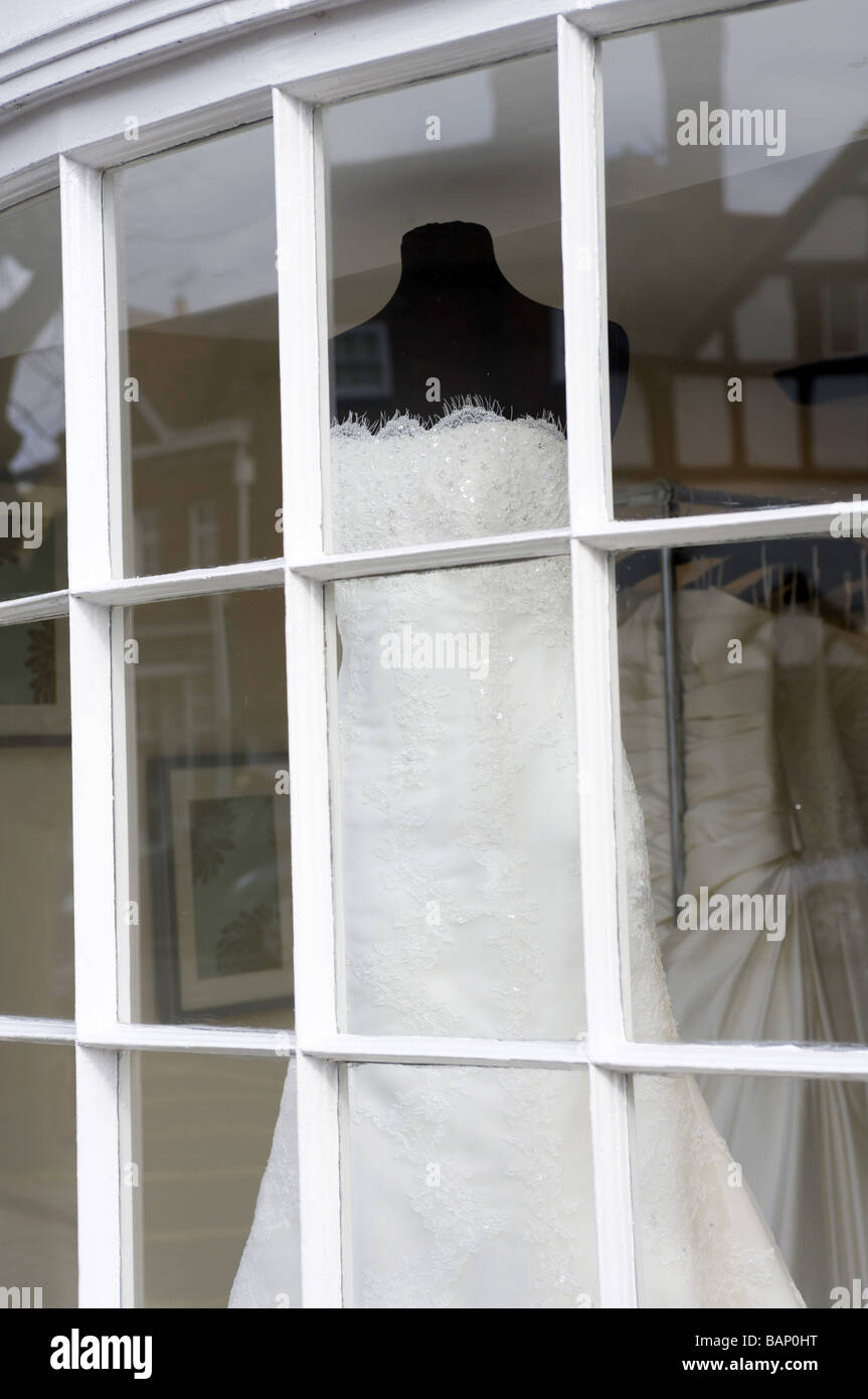 wedding dress in window of bridal shop Stock Photo - Alamy