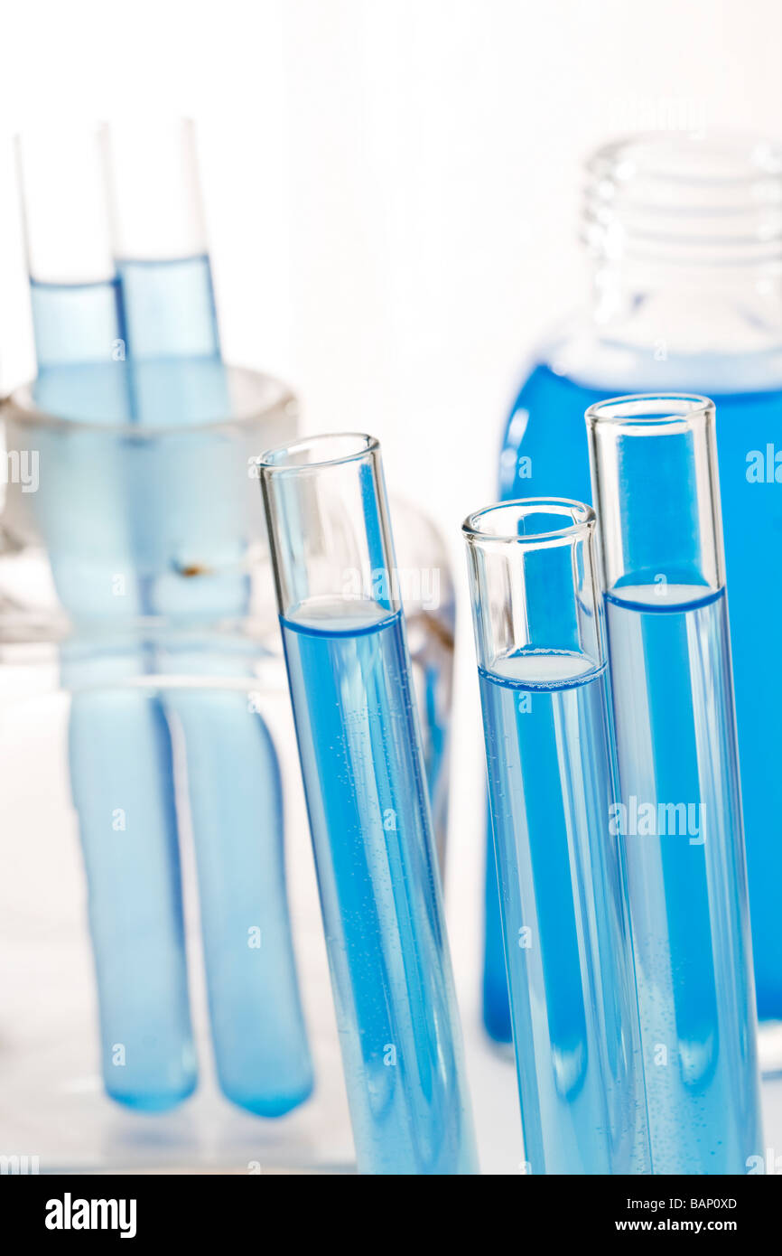 Blue chemical in laboratory testing tubes White background Stock Photo ...