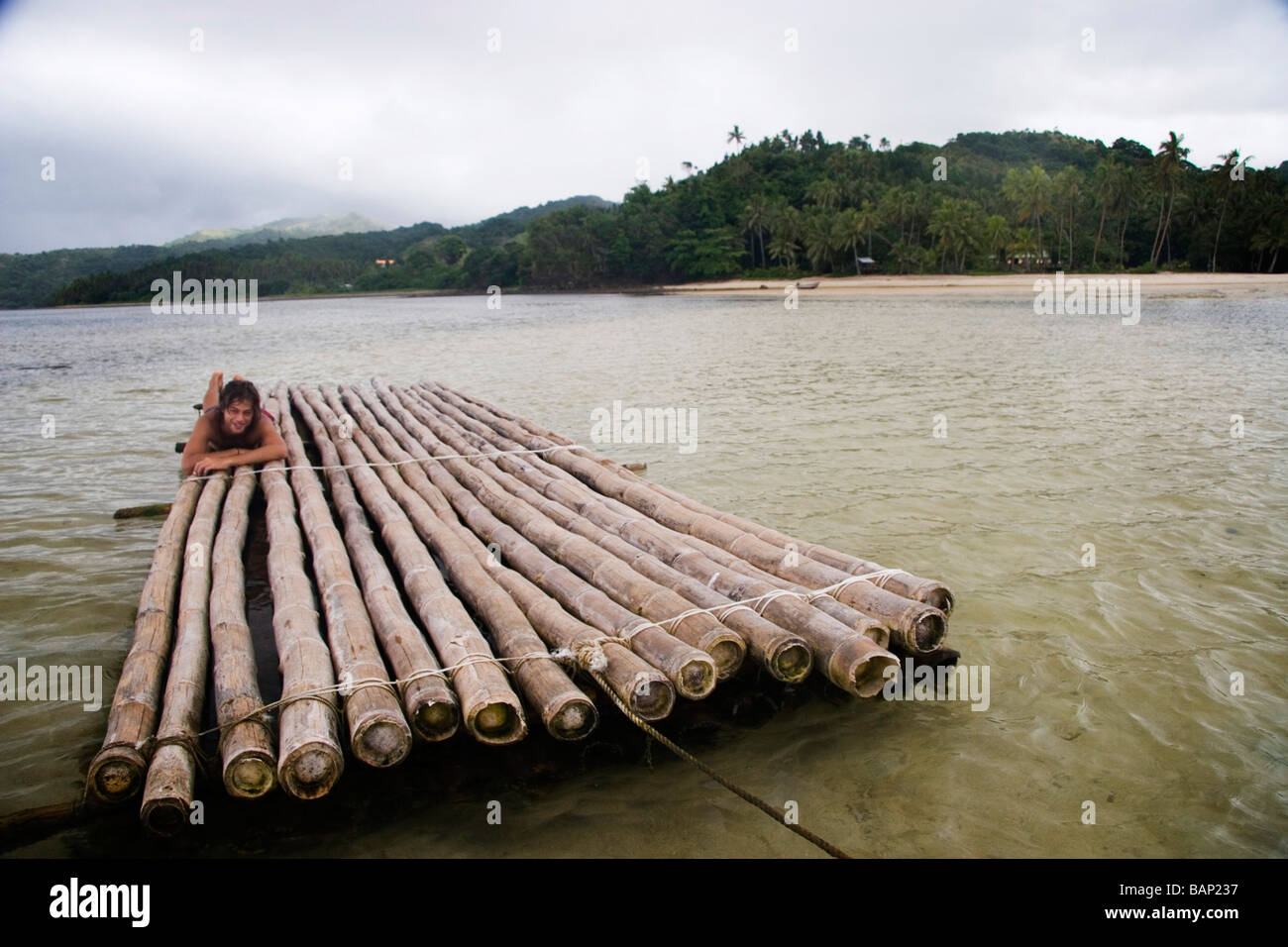 Man on raft Stock Photo - Alamy