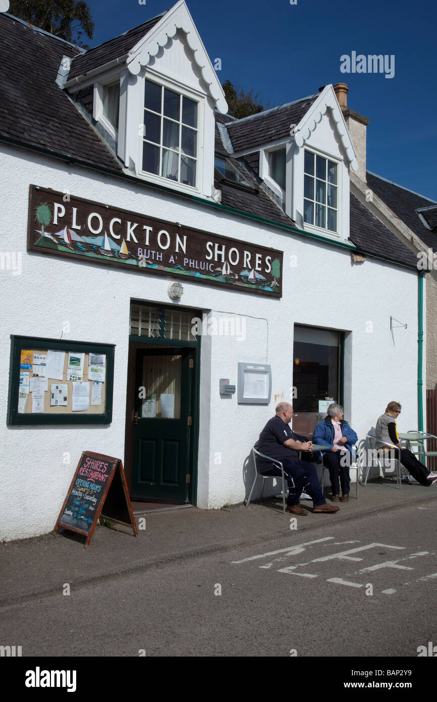 A Seaside Cafe Group enjoying spring sunshire at Portree, Scotland, UK ...