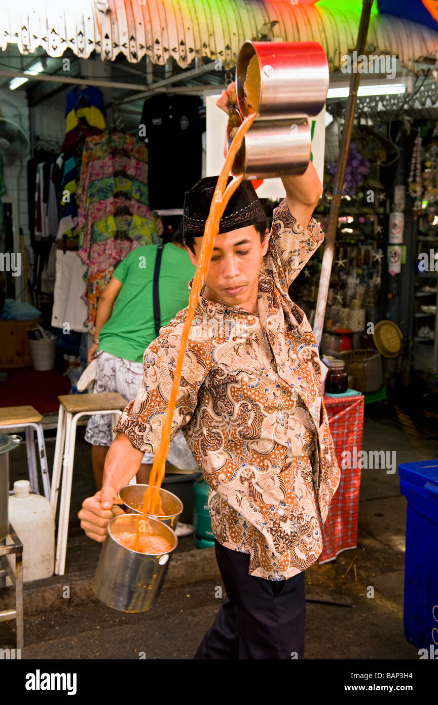 Vendor skillfully blending Thai Spiced Iced Tea. Chatuchak Weekend ...